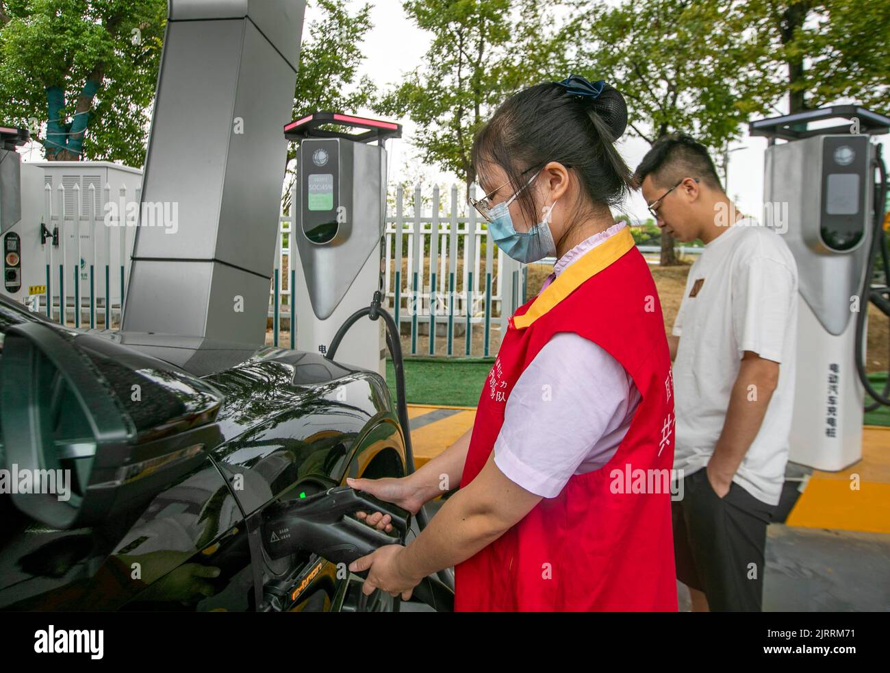 TAIZHOU, CHINA - AUGUST 26, 2022 - An electric vehicle is charged at a ...