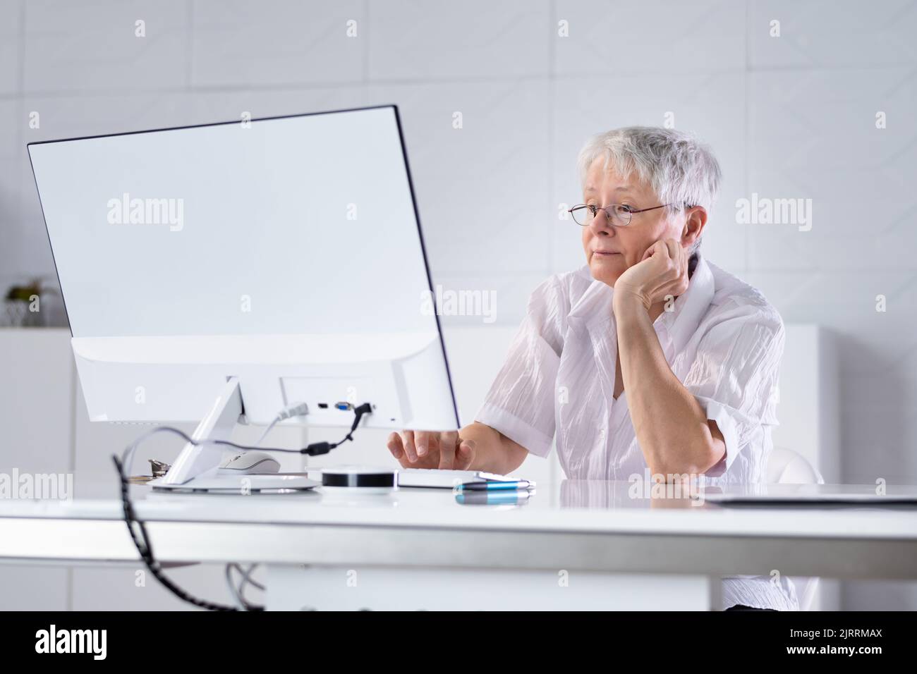 Sad Bored Employee Watching Virtual Presentation On Computer Stock ...