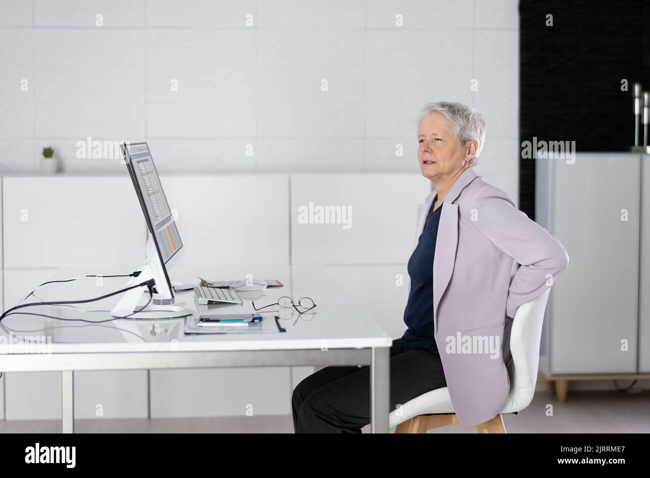 Woman With Back Pain. Bad Office Posture Stock Photo - Alamy