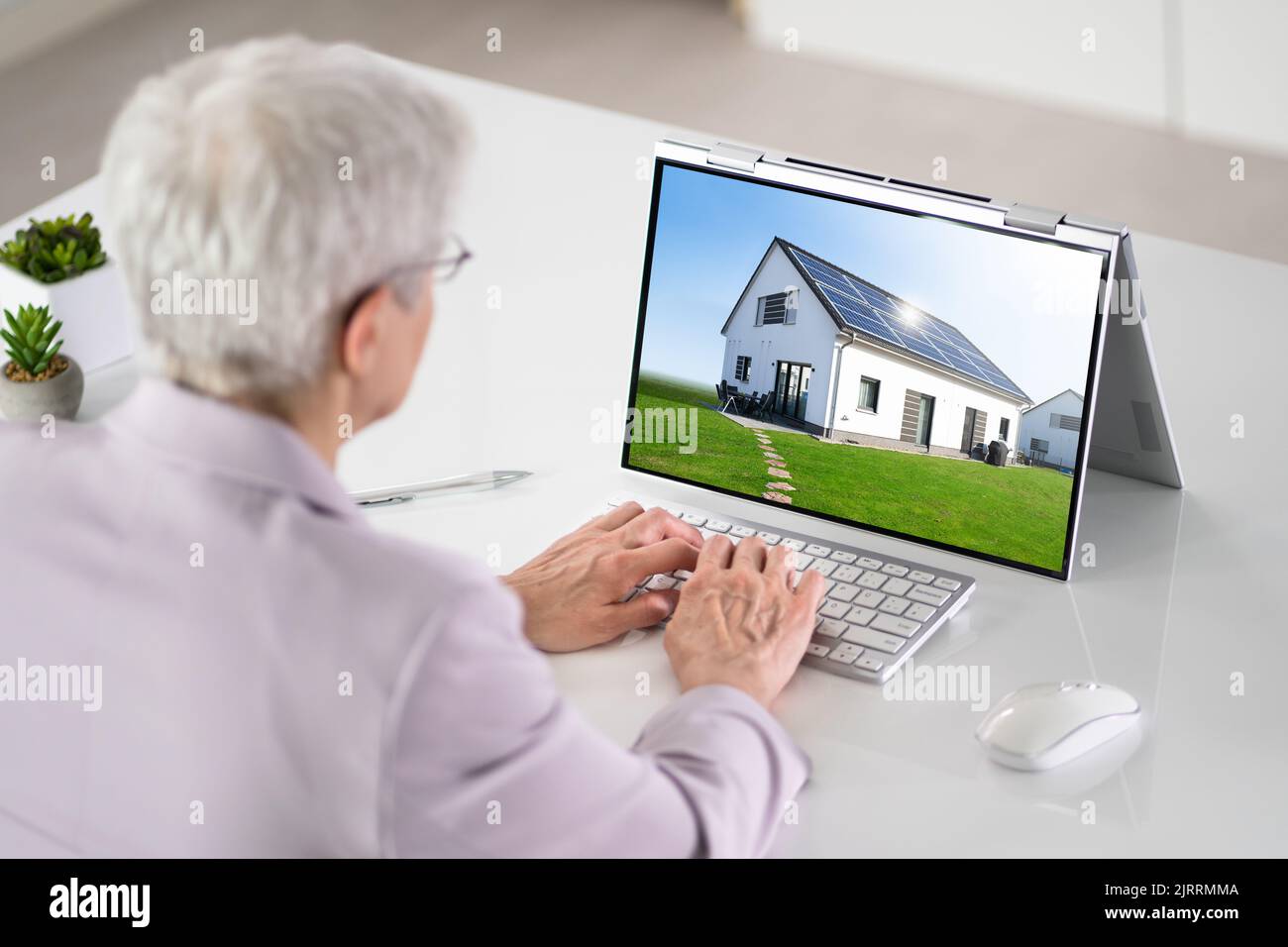 Online Real Estate Home Search On Convertible Laptop Stock Photo - Alamy