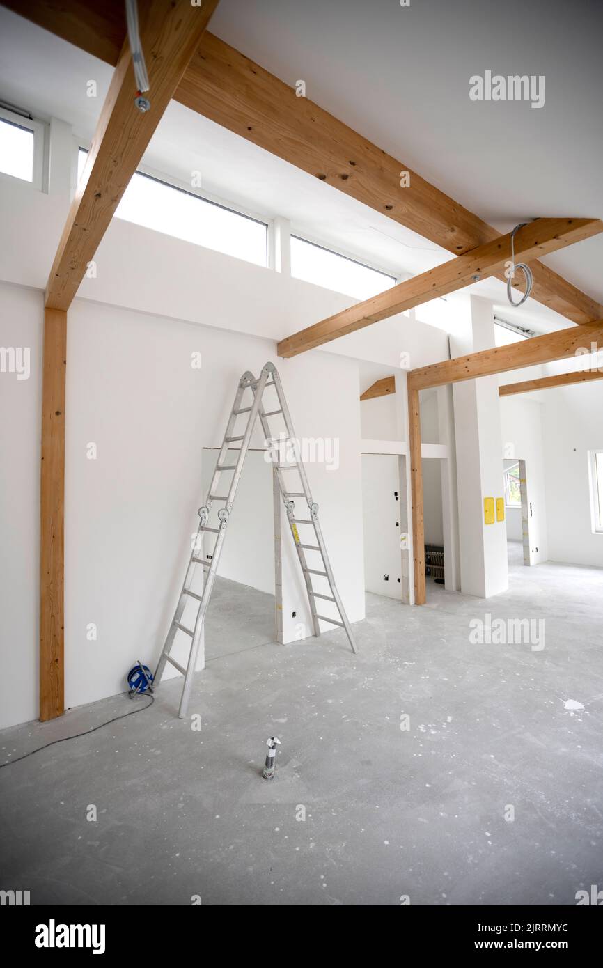 modern attic construction site freshly painted, the floor is still ...