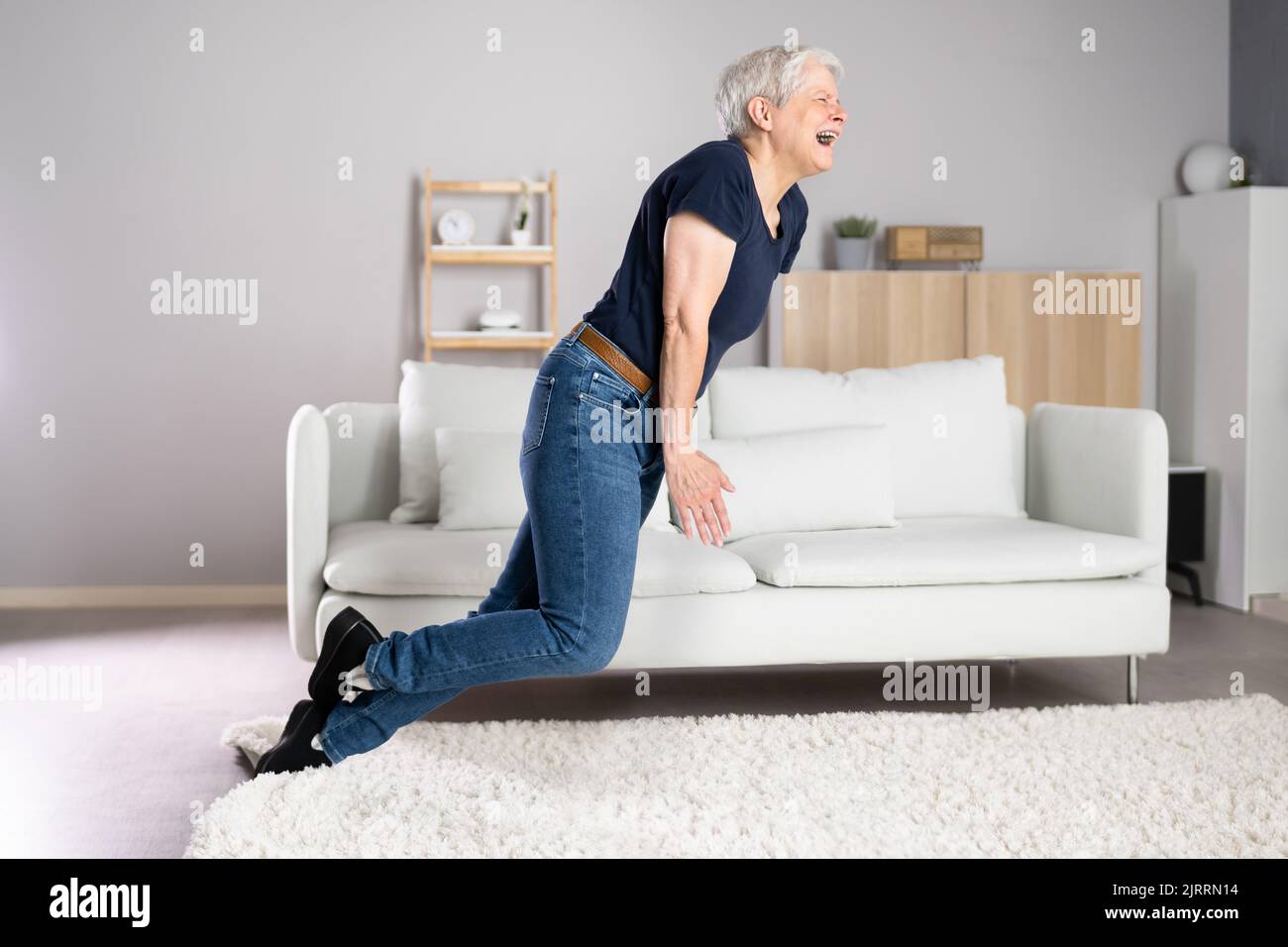 Woman Carpet Stumble Accident And Falldown In House Stock Photo - Alamy