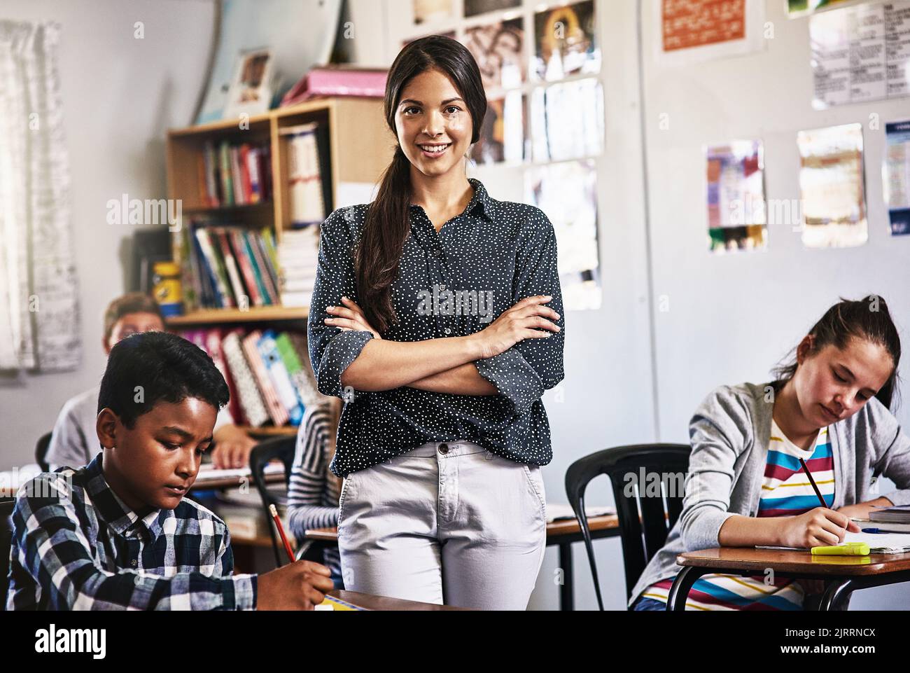 Your kids are in capable hands. Portrait of an attractive young teacher ...