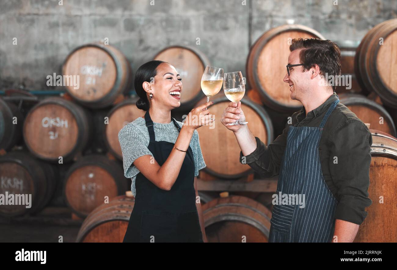 Wine, glass and toast with a couple who drink alcohol in a cellar ...