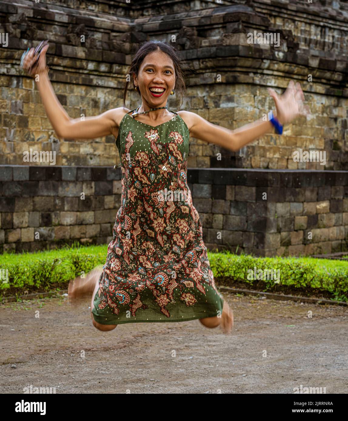 Indonesia, June 13 2022 - Young woman jumps for joy at Borobudur Temple ...