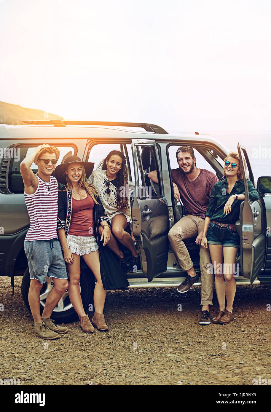 The roadtrip crew. Portrait of a group of friends enjoying a roadtrip ...