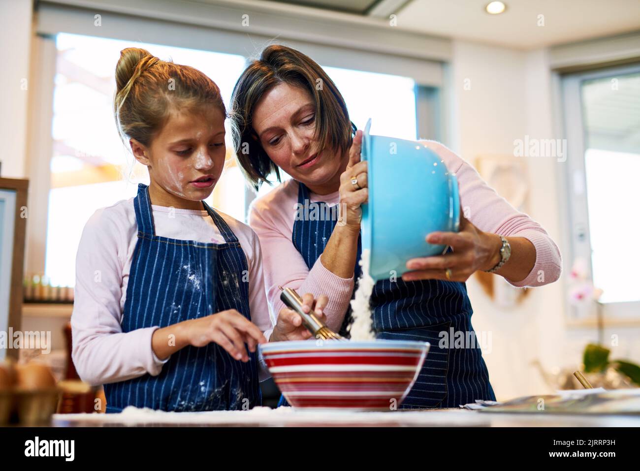 They always bake as a mother and daughter team. a mother and her little ...