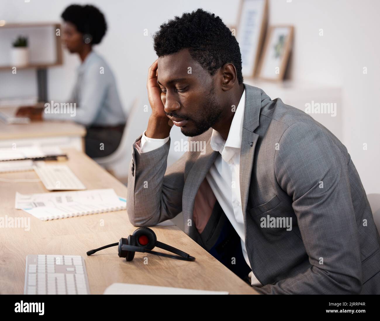 Tired, sleeping and overworked while working late in a call center or ... Tired, sleeping and overworked while working late in a call center or ...