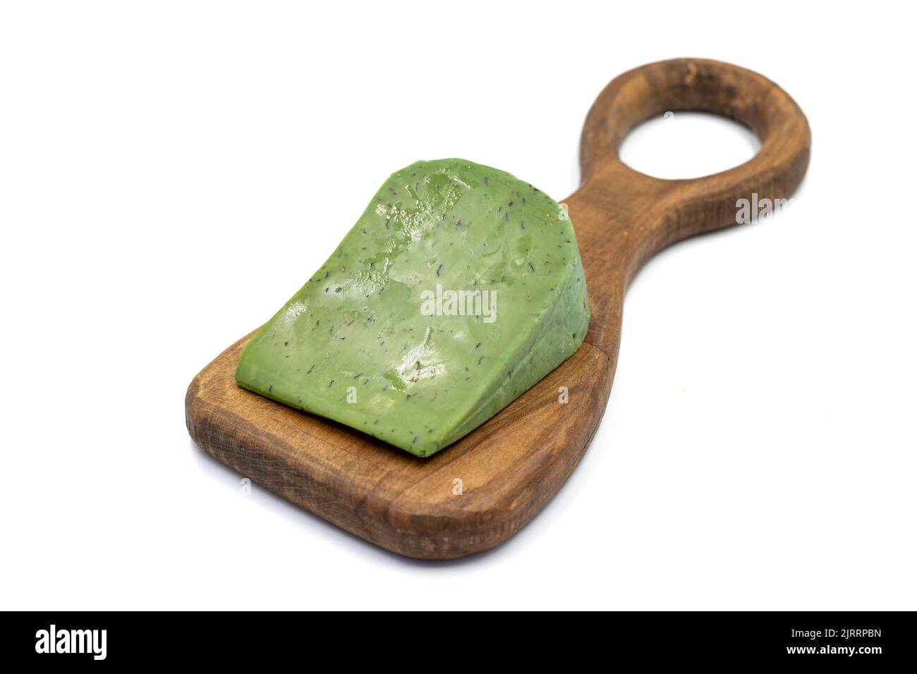 Green gouda cheese. Gouda cheese with basil isolated on a white ...