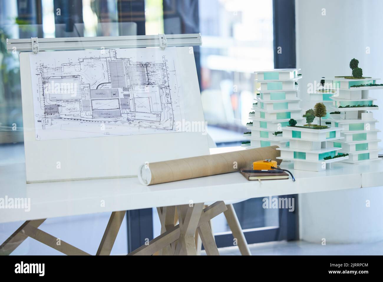 Architecture, design and blueprints on an office desk with plans and a ...