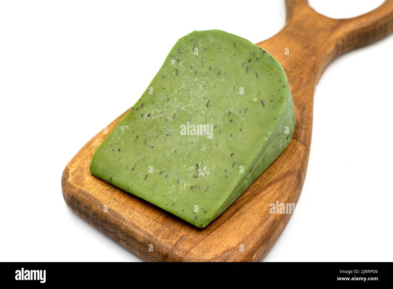 Green gouda cheese. Gouda cheese with basil isolated on a white ...