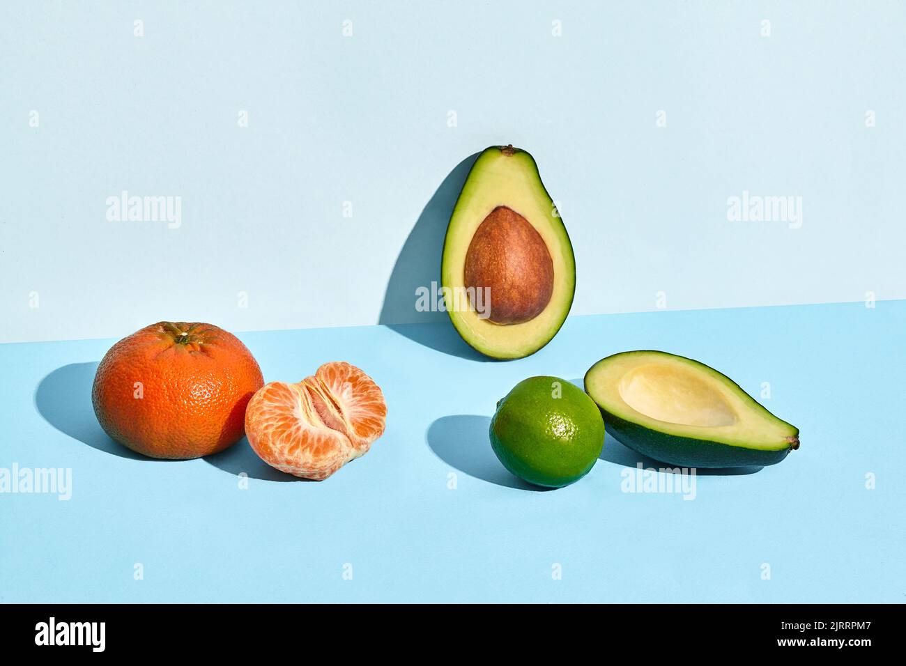 Composition of fresh fruits, mandarin lime and two halfs of cutted ...