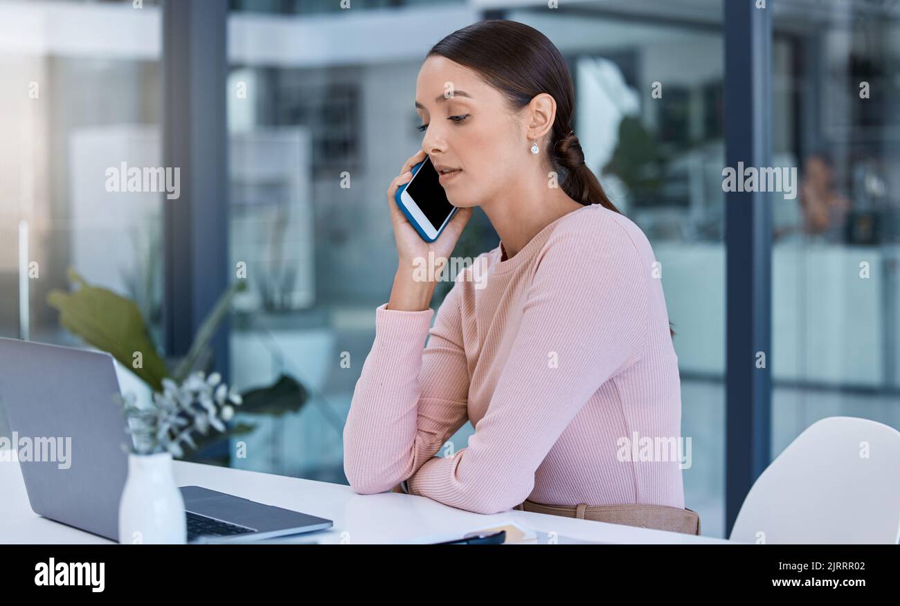 Corporate employee phone call with client, reading calendar on laptop ...