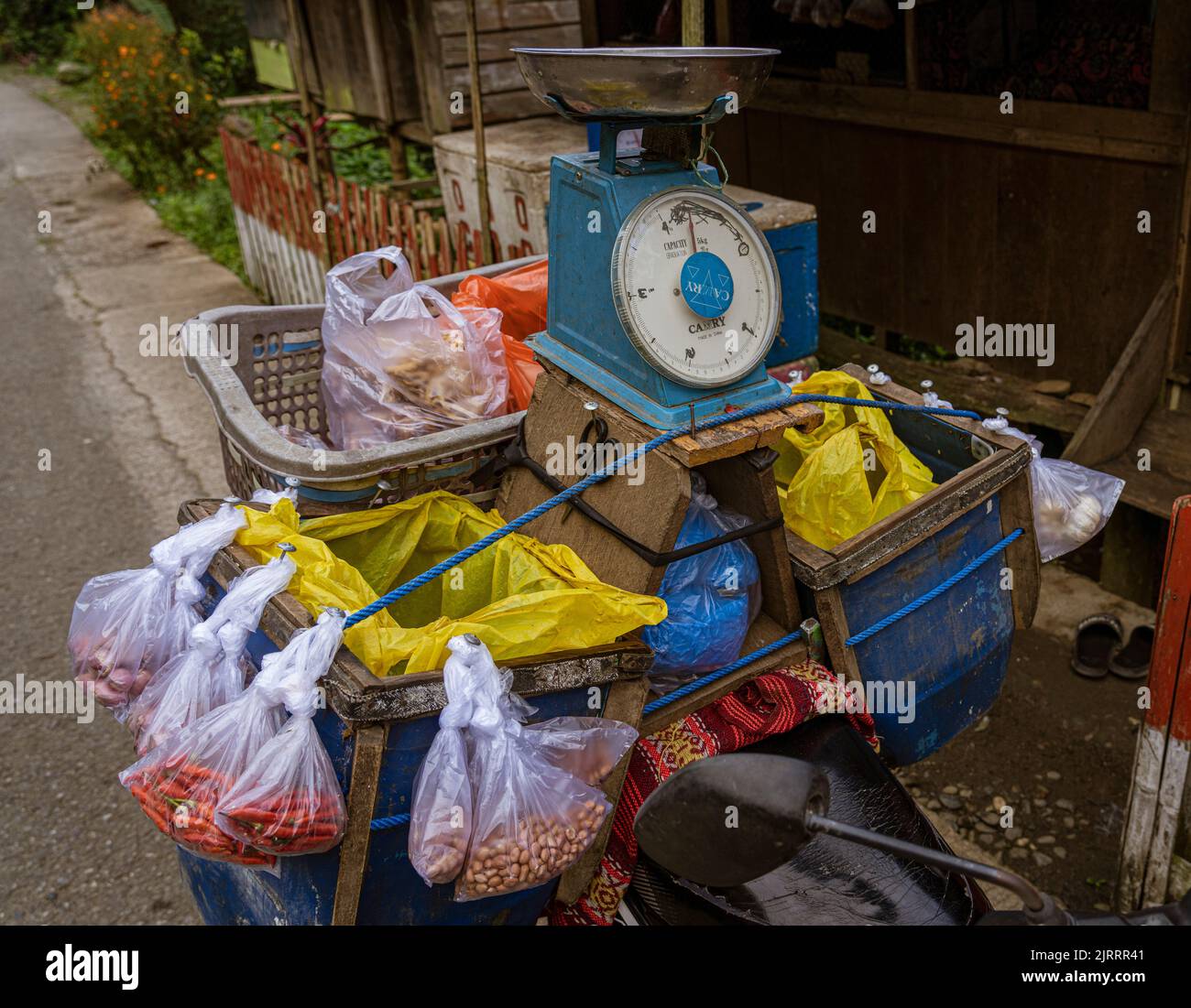 Indonesia, June 13 2022 - Motorcycles are loaded down with goods to ...