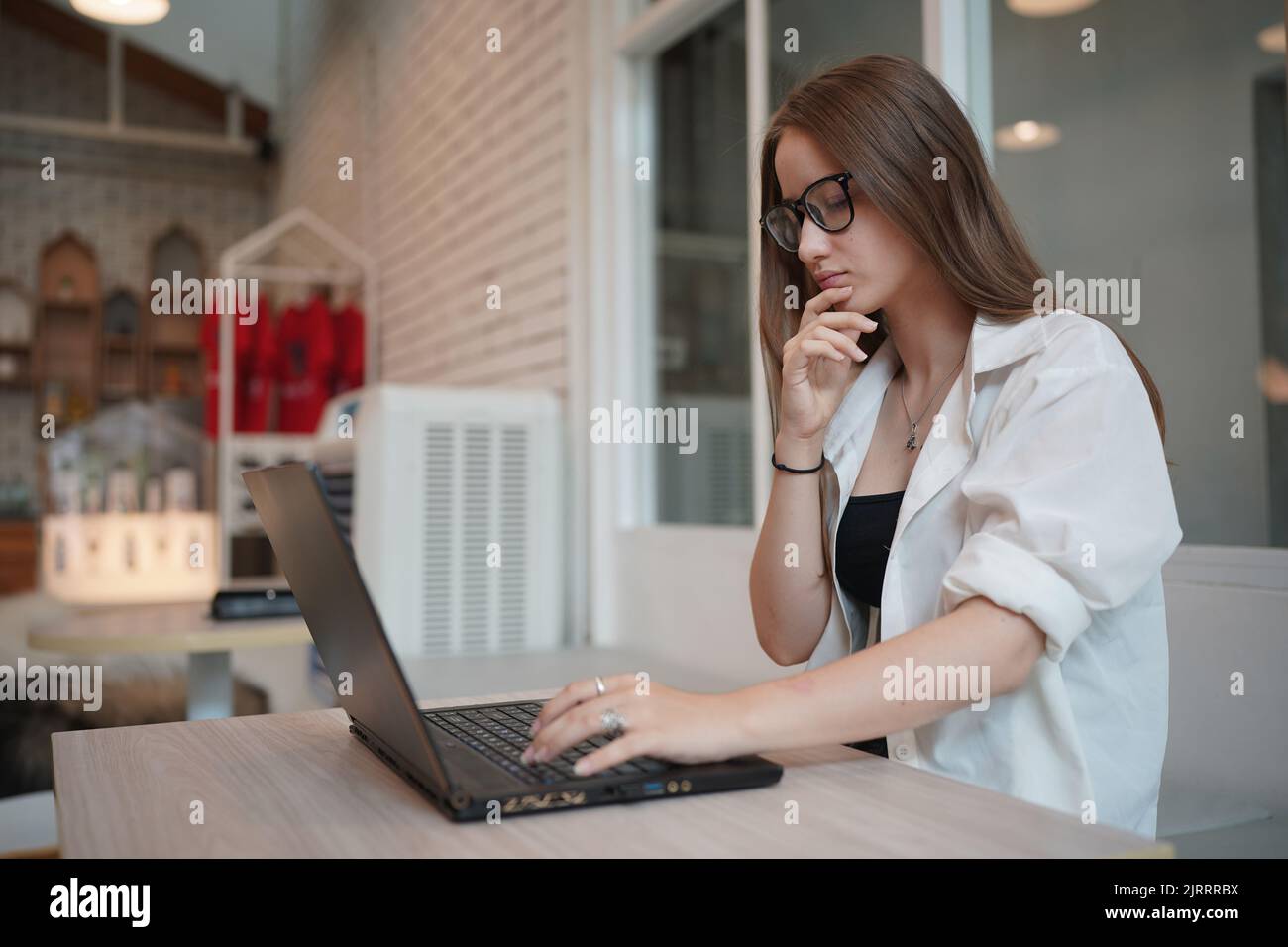 Technology and people concept, young woman using laptop and internet ...
