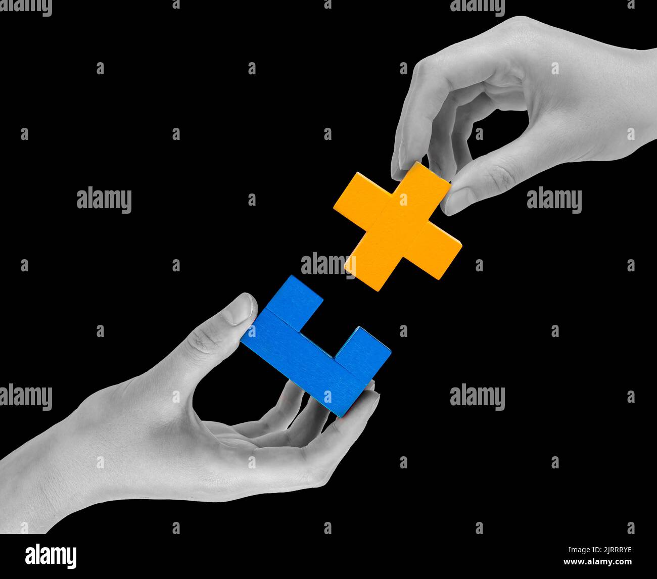 Two hands connecting puzzle pieces. Partnership, teamwork, connection ...
