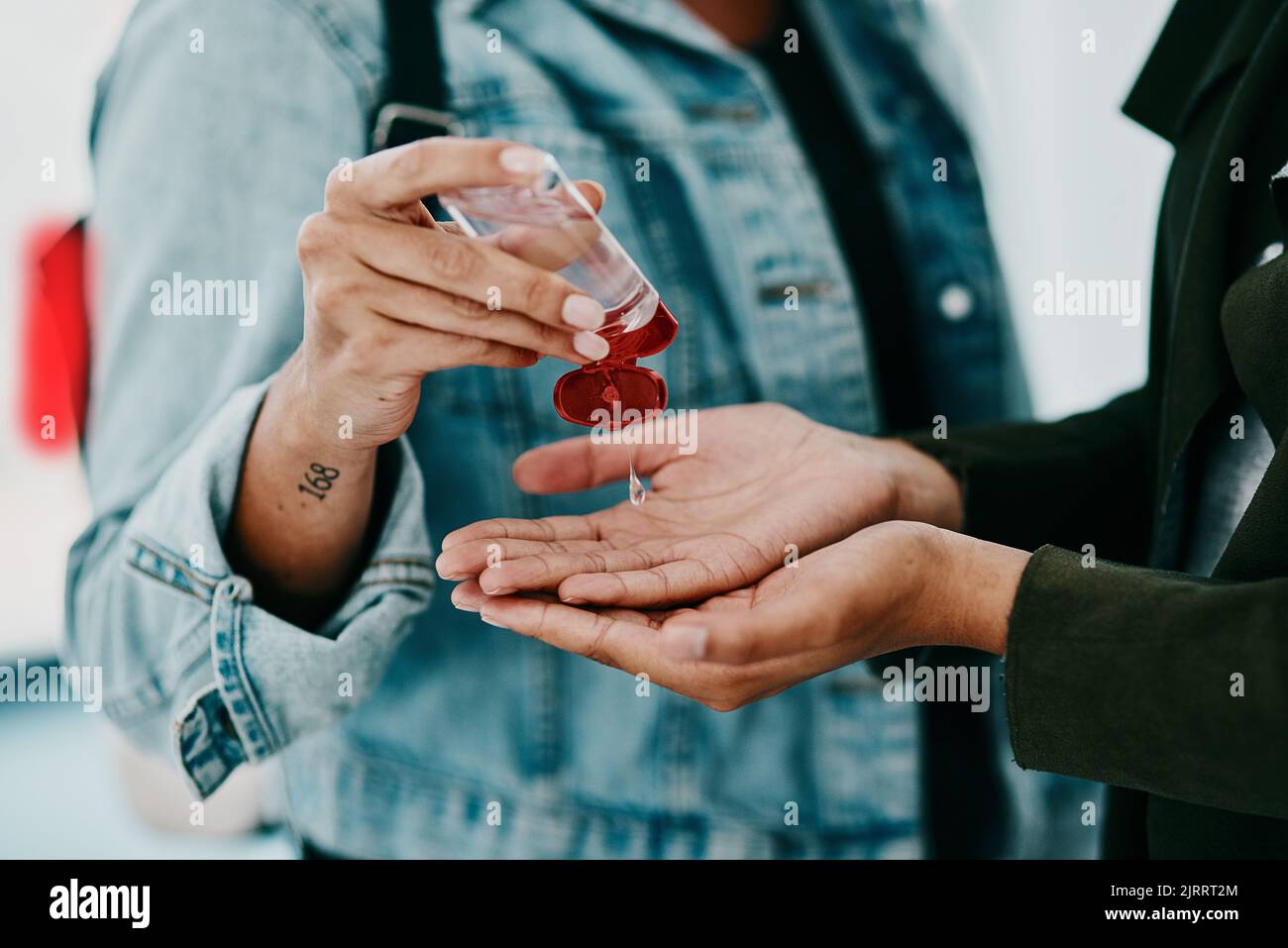 Closeup of woman cleaning themselves with hand sanitizer, medical and ...