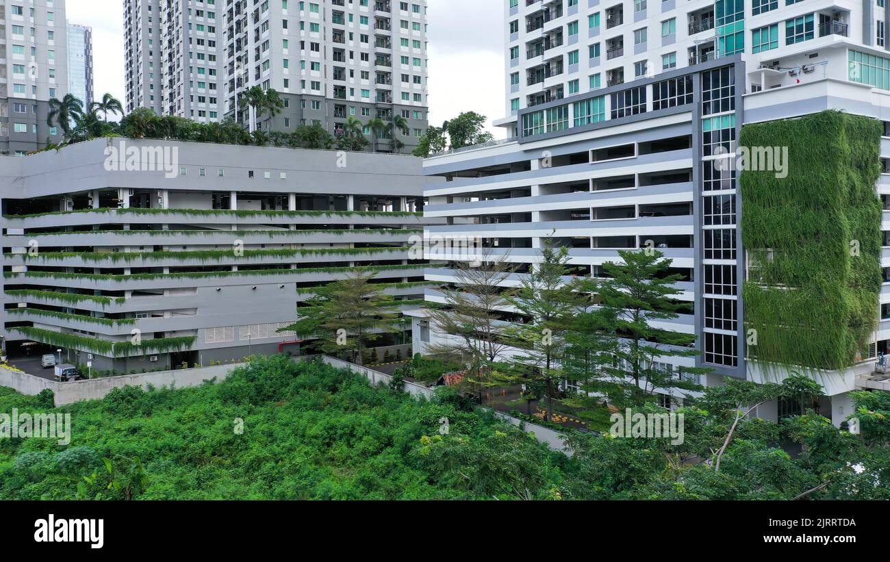 Multi level parking garage facade and exterior. Background high rise ...