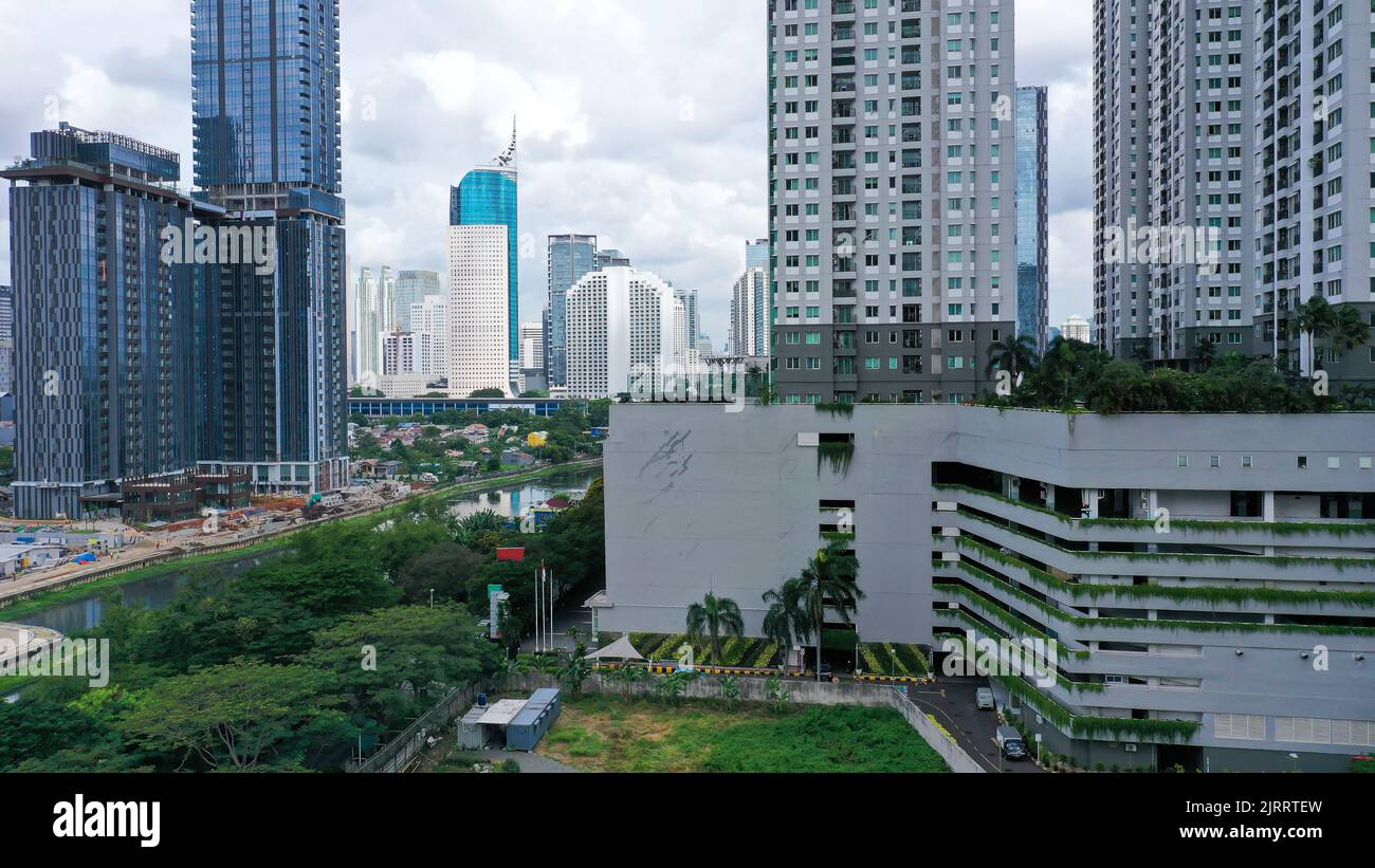 Multi level parking garage facade and exterior. Background high rise ...