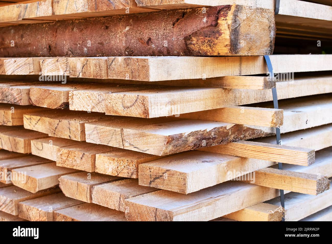 Folded finished boards at the sawmill close up Stock Photo - Alamy