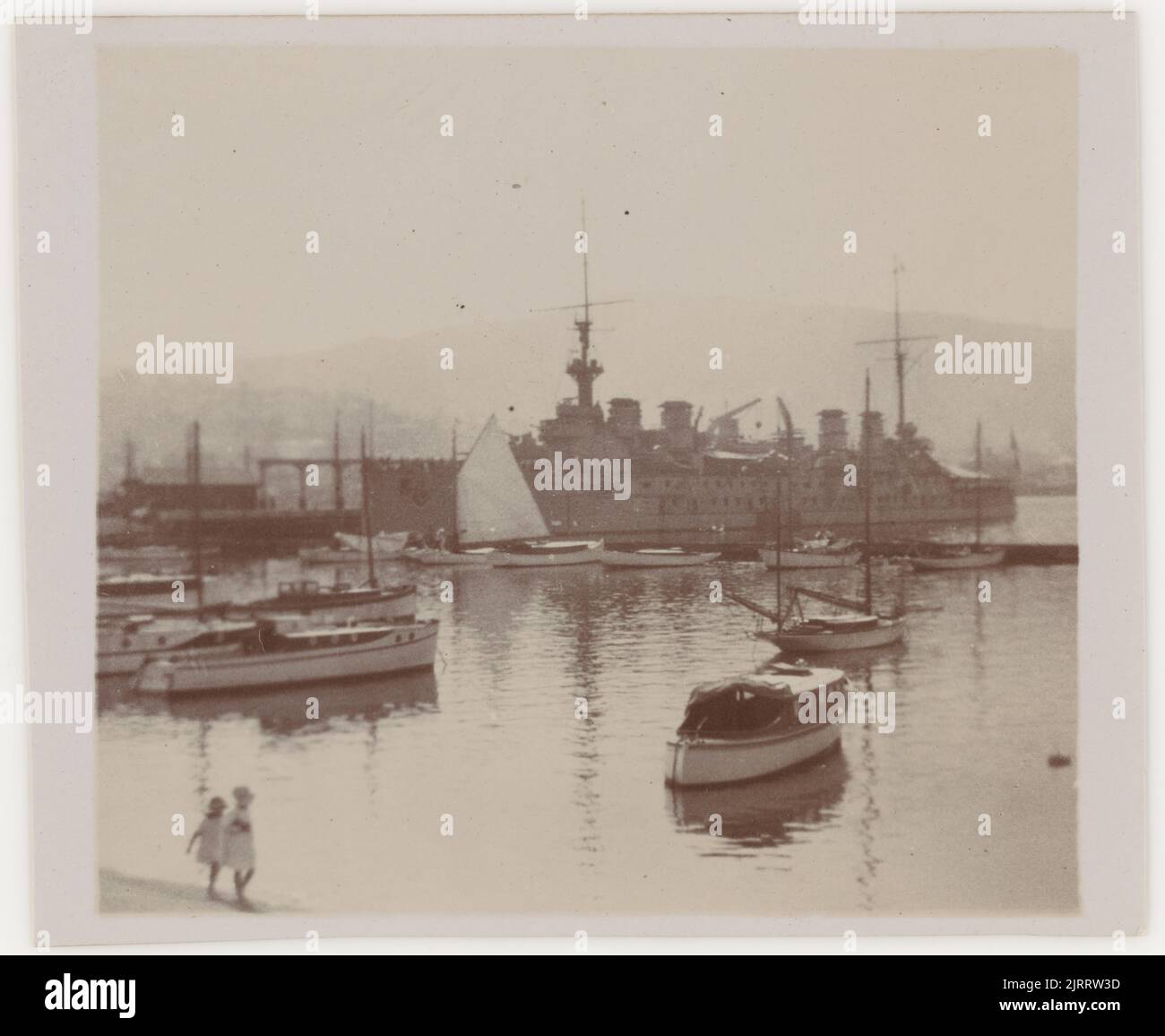 [Battleship in harbour], 1920s to 1930s, New Zealand, by Roland Searle ...