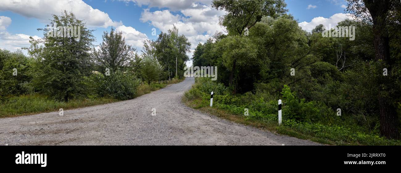 A gravel road at rural Europe. Suburban road path Stock Photo - Alamy