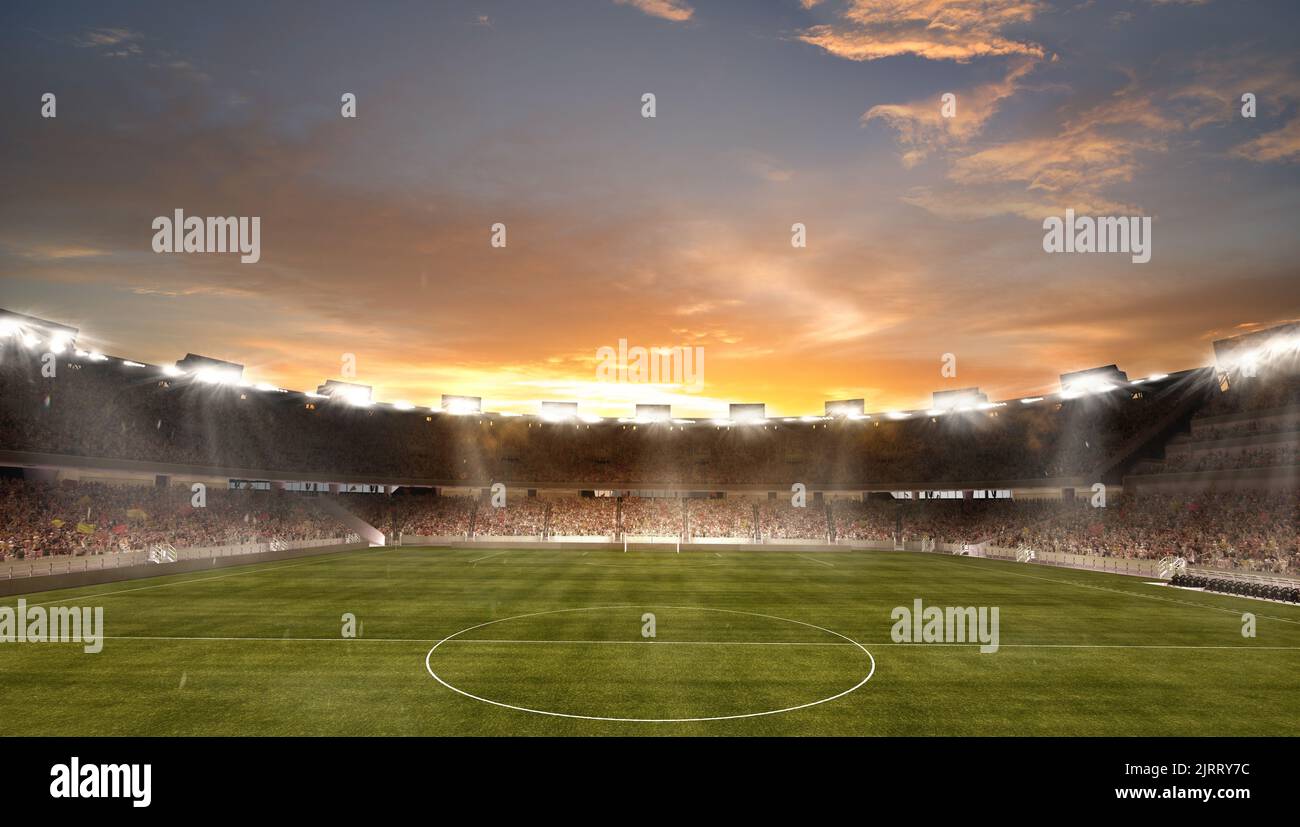 Sunset above empty football field with flashlights and dark night sky ...