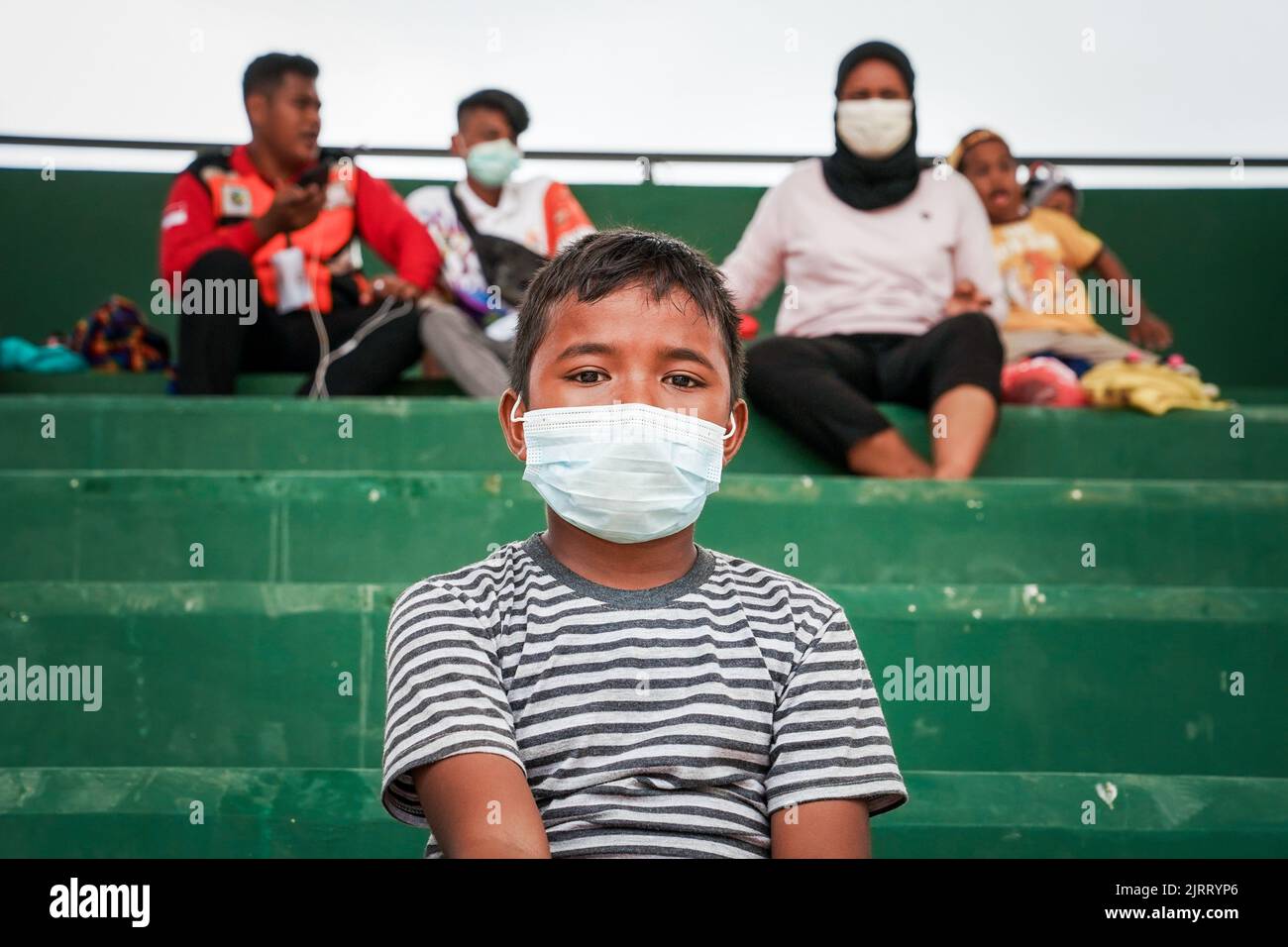 Some Papuan children play while wearing masks to prevent transmission ...