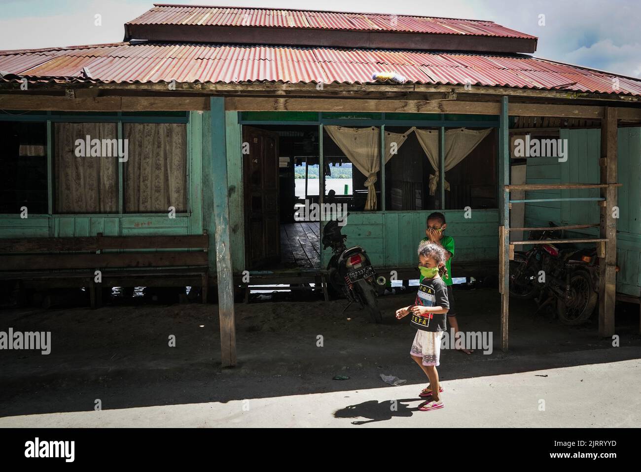 Some Papuan children play while wearing masks to prevent transmission ...