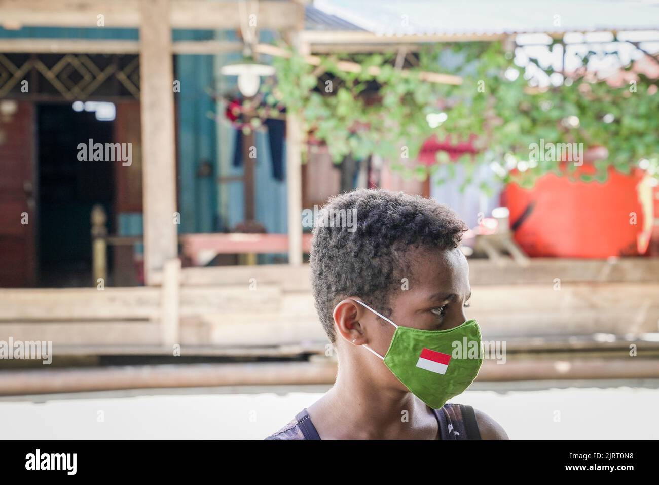 Some Papuan children play while wearing masks to prevent transmission ...