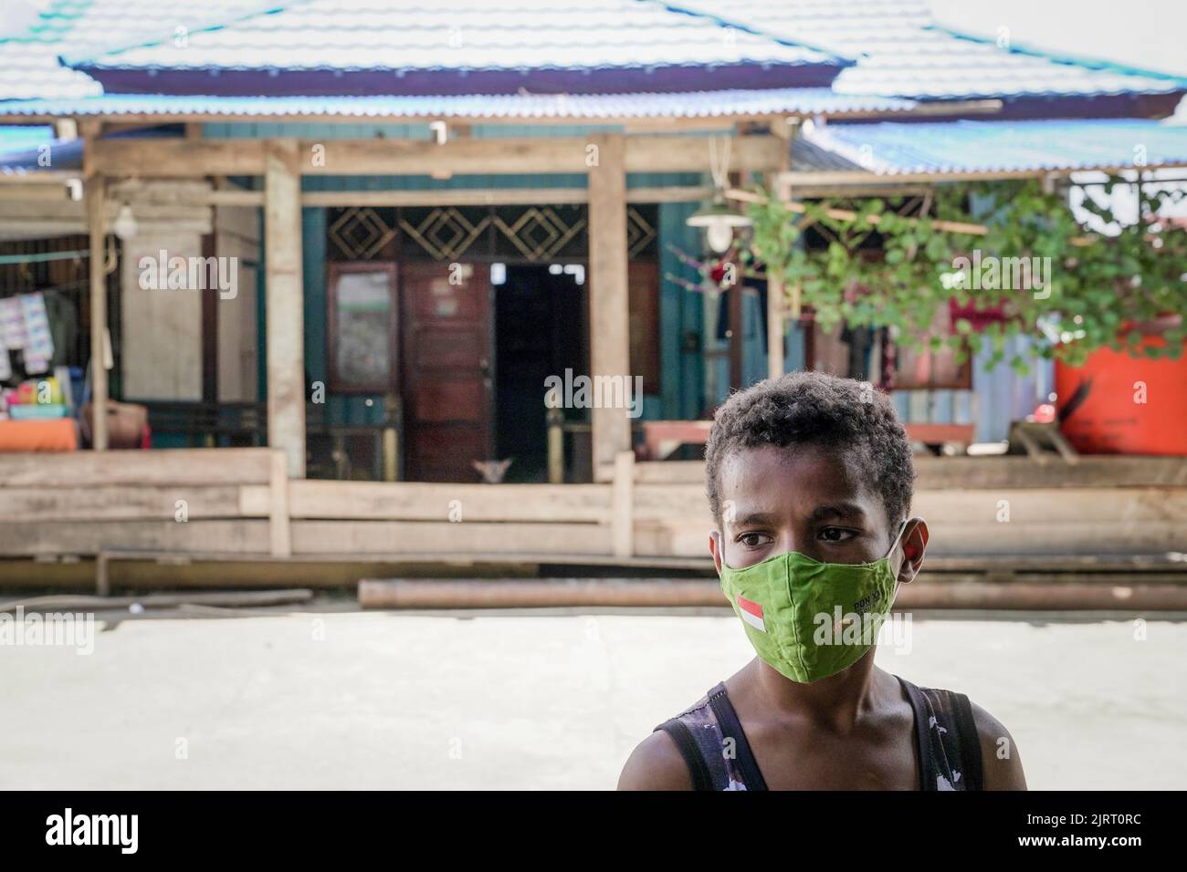 Some Papuan children play while wearing masks to prevent transmission ...