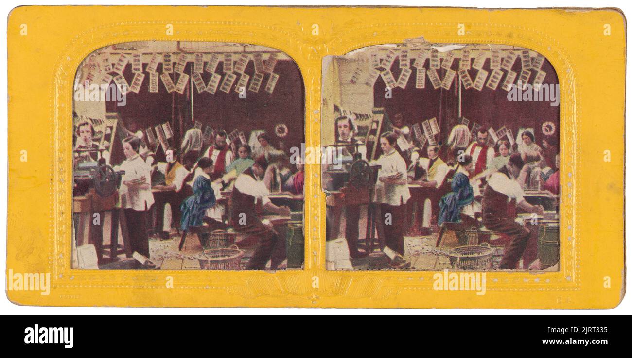 People working in a newspaper office; a young woman looks at images on ...