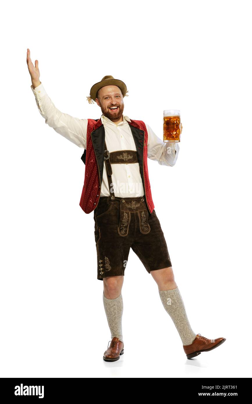 Portrait of cheerful man wearing traditional Bavarian or German clothes ...