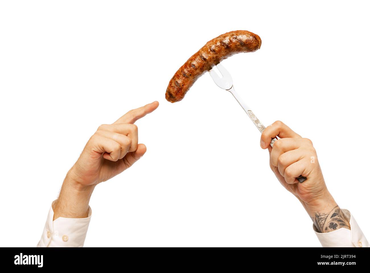 Male hands with grilled sausage on fork isolated over white studio ...