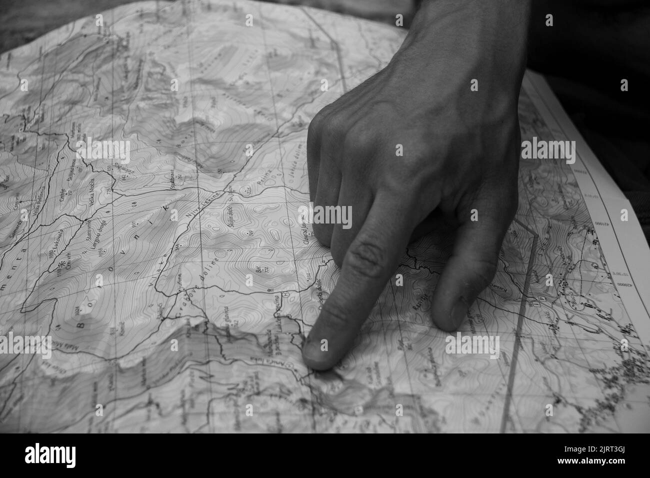 Finger pointing on map Black and White Stock Photos & Images - Alamy