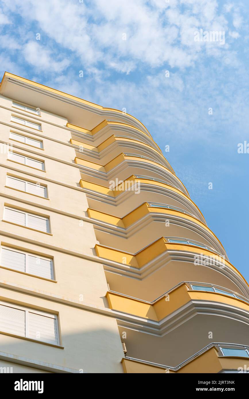 Low angle view of an apartment building with balconies. Residential ...