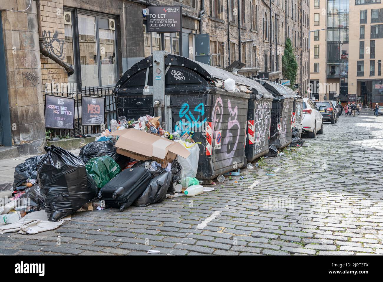 Rubbish piling up in the street during the Edinburgh Festivals and a ...