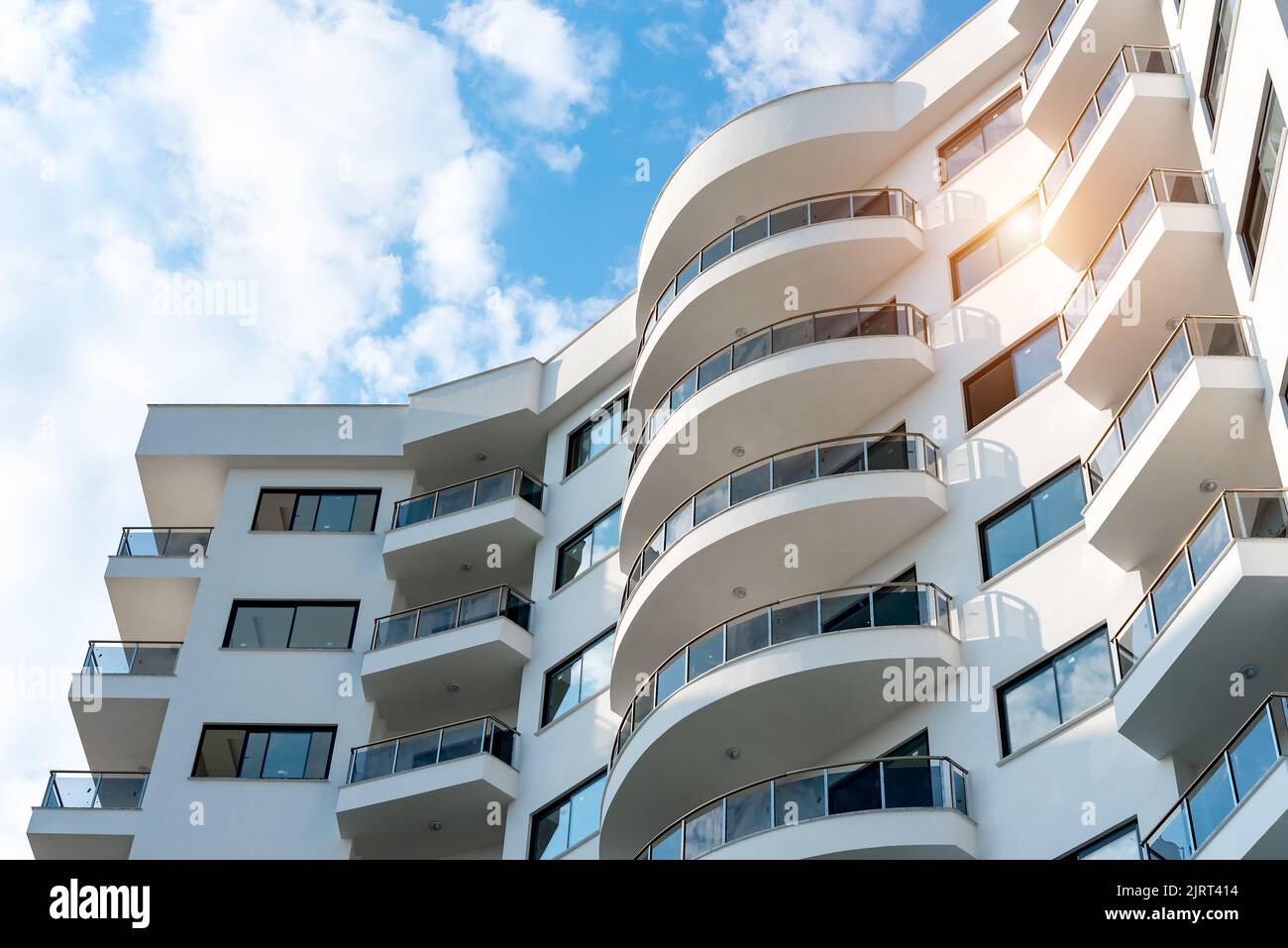 Low angle view of an apartment building with balconies. Residential ...