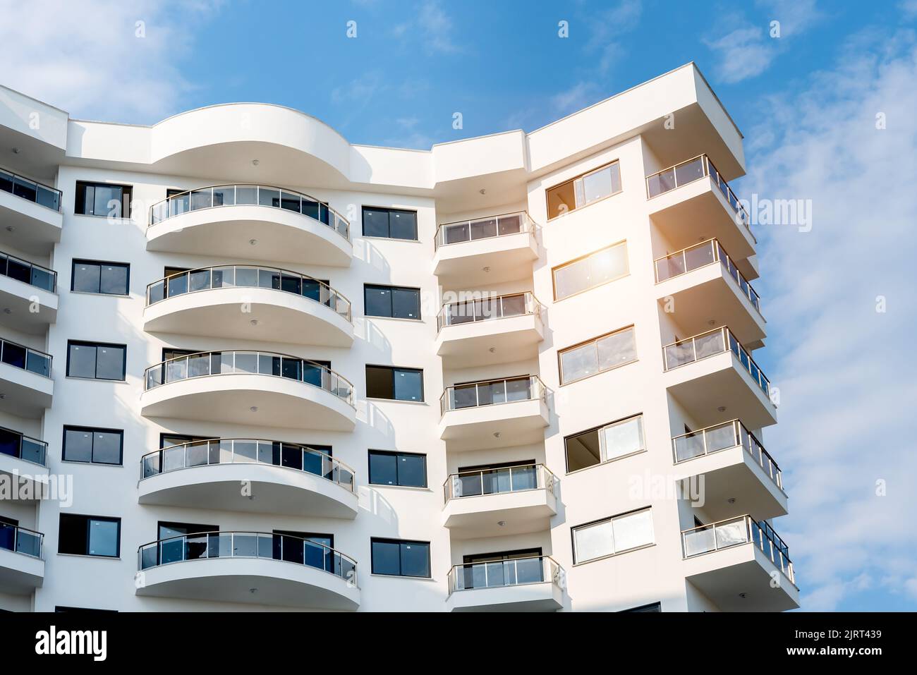 Low angle view of an apartment building with balconies. Residential ...