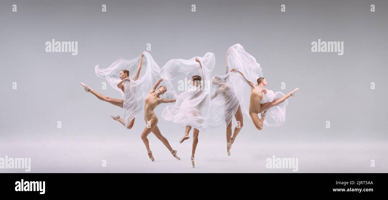 Portrait of young ballerina dancing with transparent white fabric ...