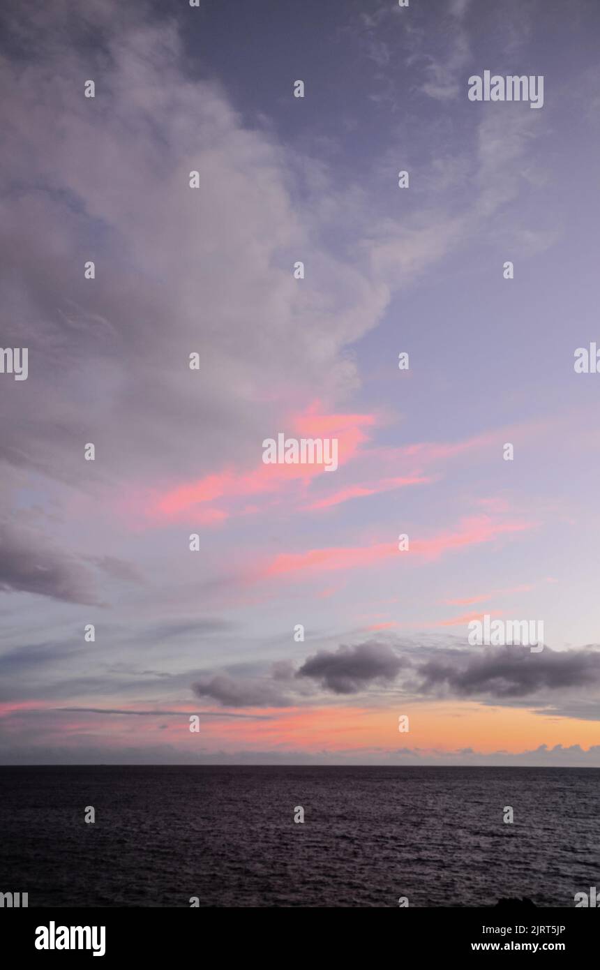 Cloudscape, Colored Clouds at Sunset near the Ocean Stock Photo - Alamy