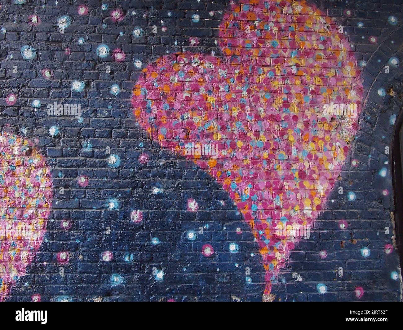 Pink Heart on Painted Brick Wall Stock Photo - Alamy