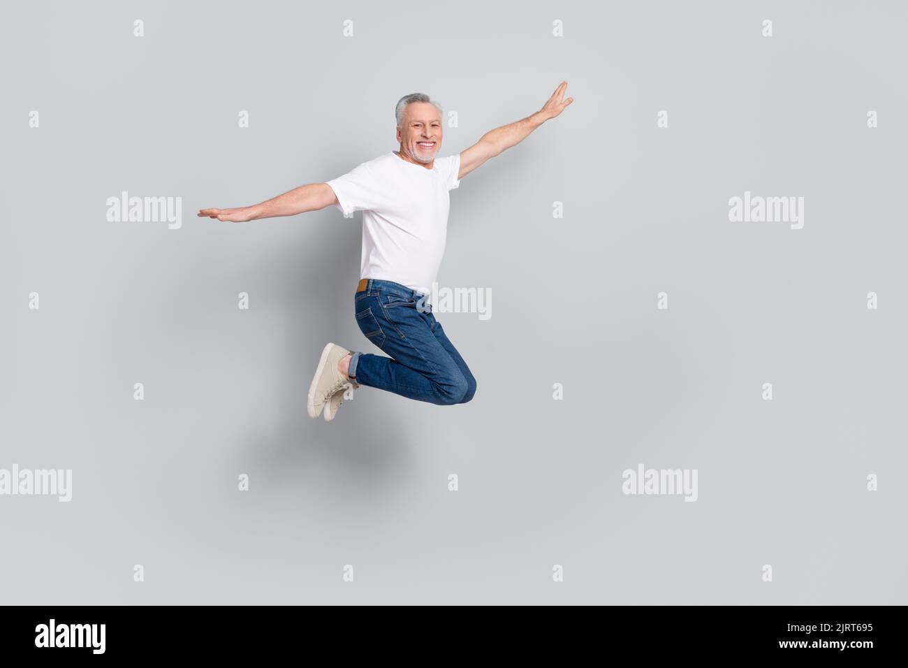 Full length body size view of attractive cheery free lucky man jumping ...
