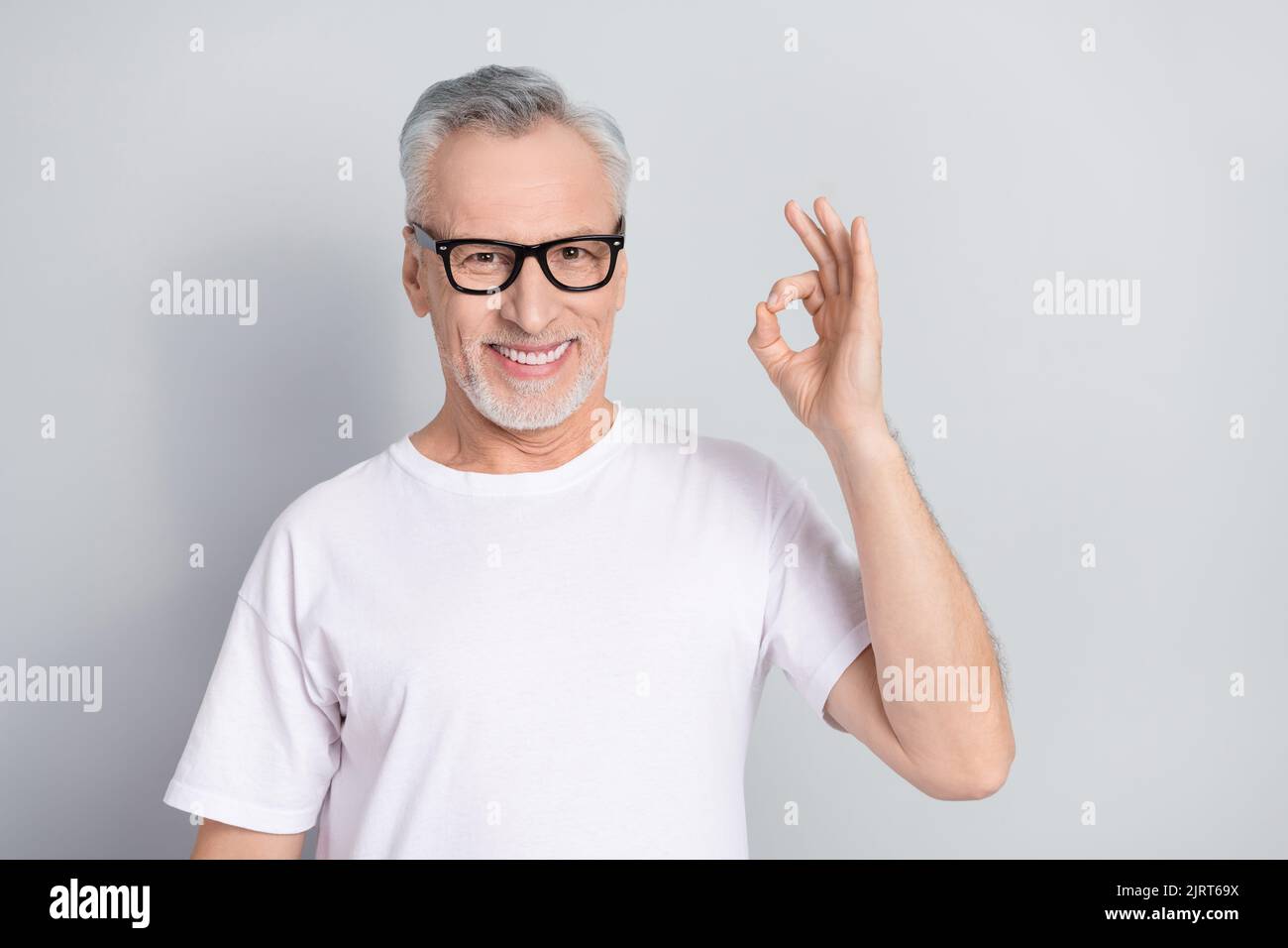 Photo of cheerful friendly person hand fingers show okey symbol ...