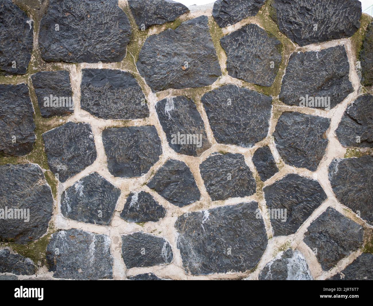 A view of a rough stone wall Stock Photo - Alamy