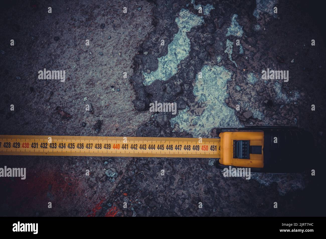 Measuring ruler on a concrete wall texture. The concept of renovation ...