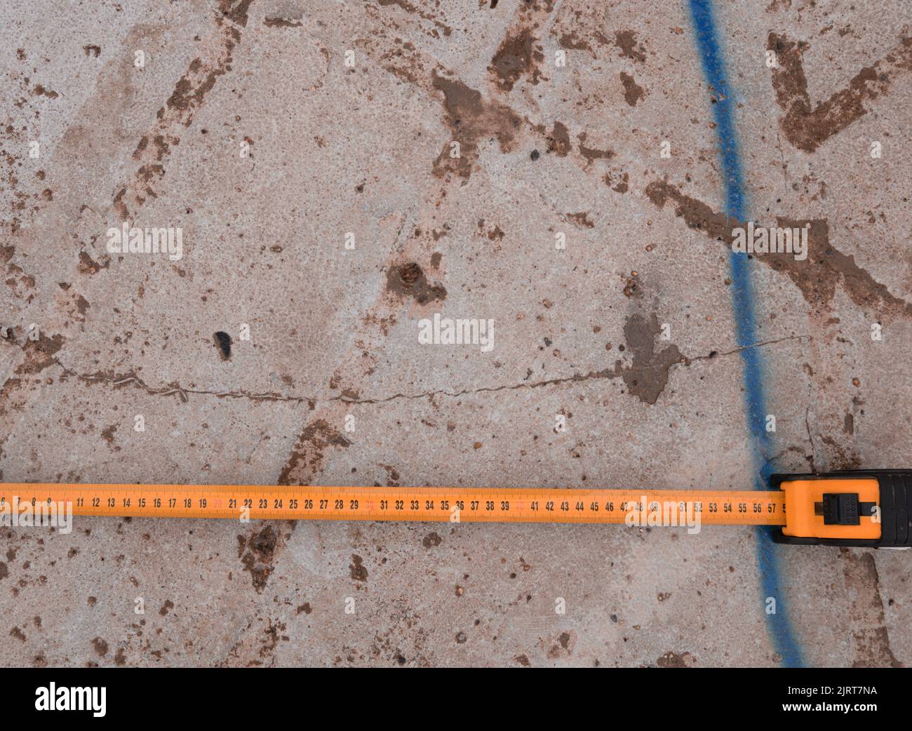 Measuring ruler on a concrete wall texture. The concept of renovation ...