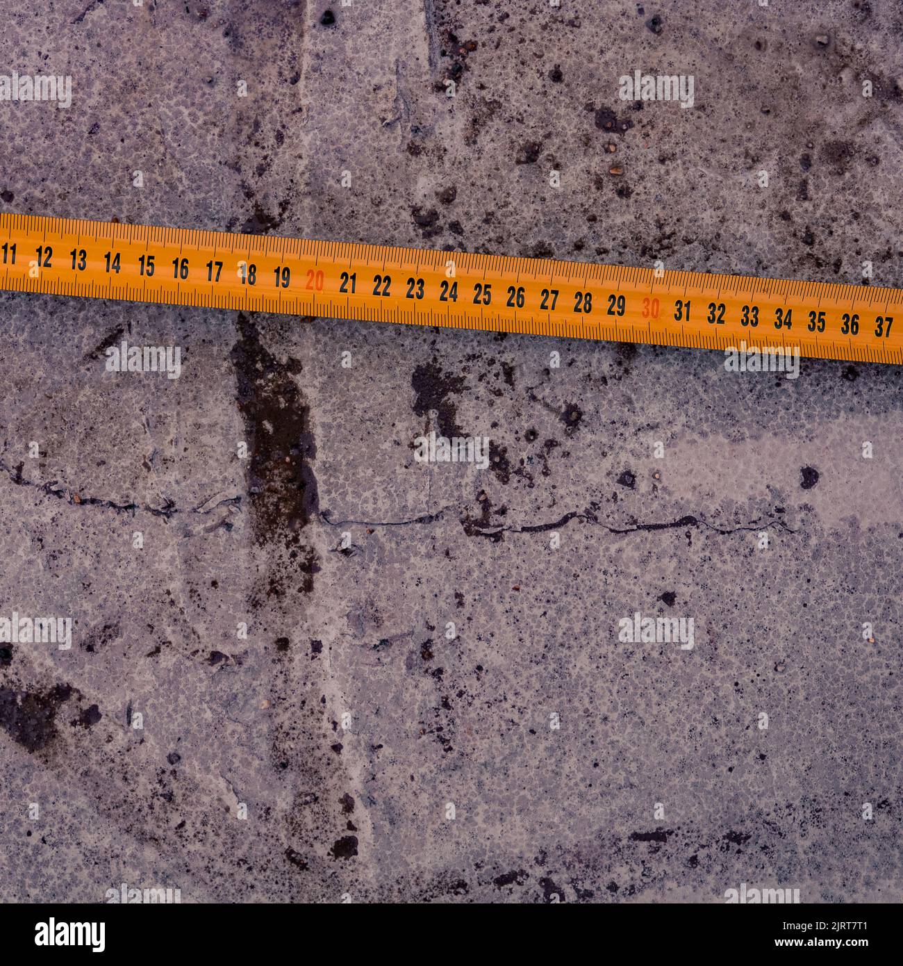 Measuring ruler on a concrete wall texture. The concept of renovation ...