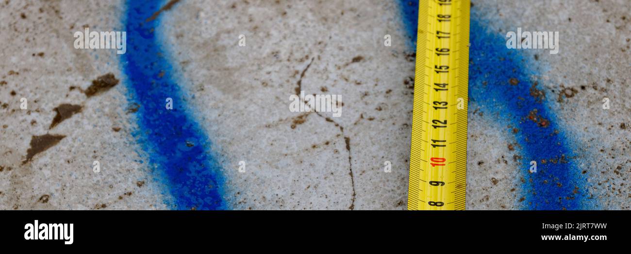 Measuring ruler on a concrete wall texture. The concept of renovation ...