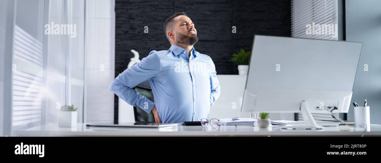 Man With Back Pain. Bad Office Posture Stock Photo - Alamy